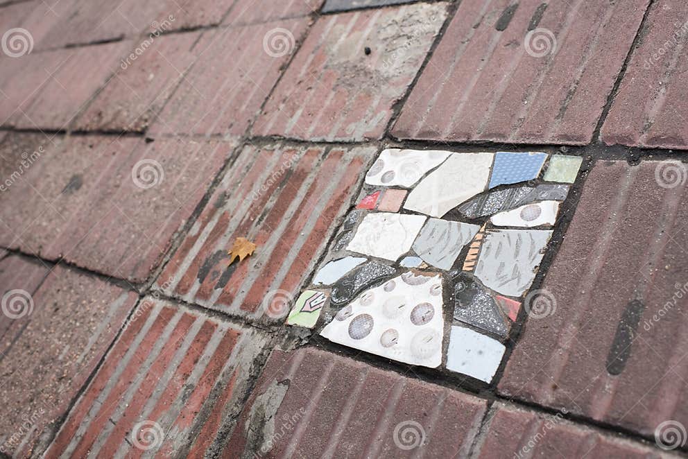 Sidewalk Tile Replaced by Broken Pieces of Different Colored Tiles ...