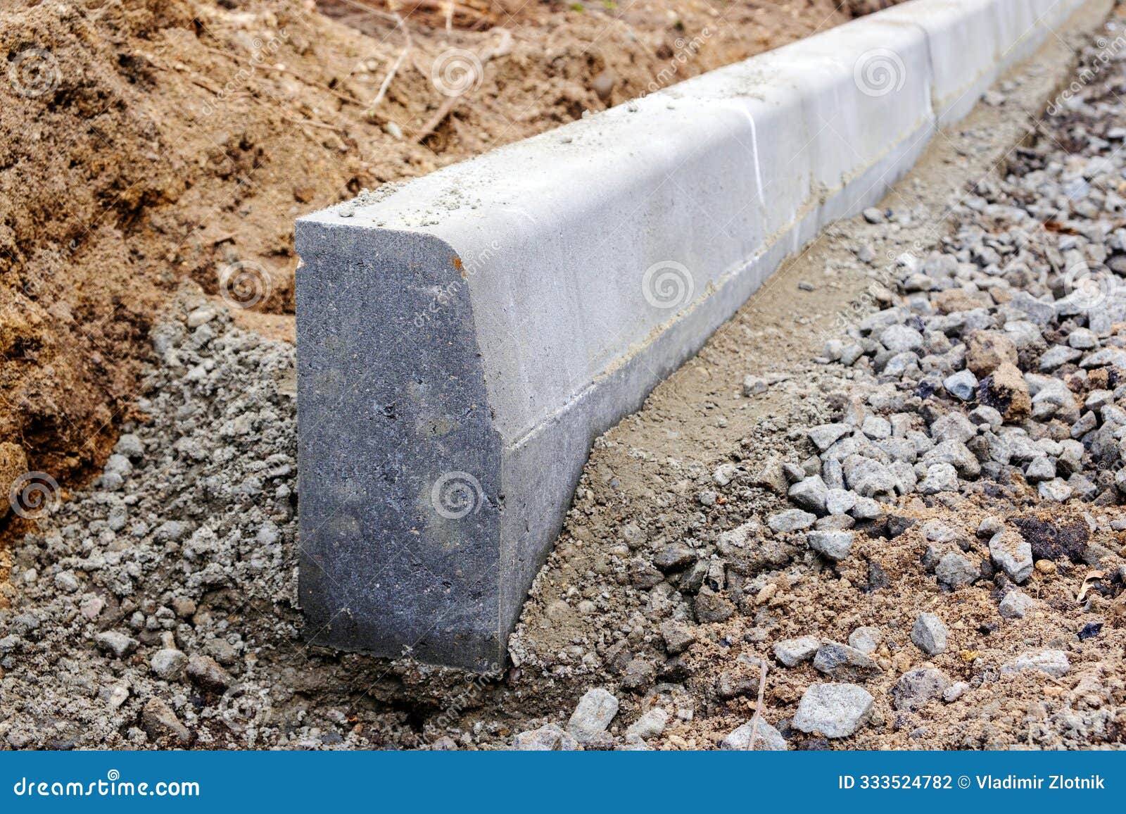 A Sidewalk is Under Construction, a Concrete Curb is Being Installed ...