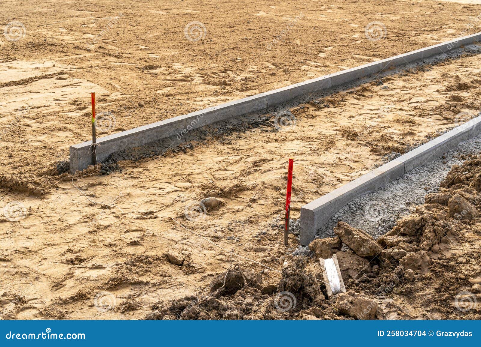 A Sidewalk is Under Construction, a Concrete Curb is Being Installed ...