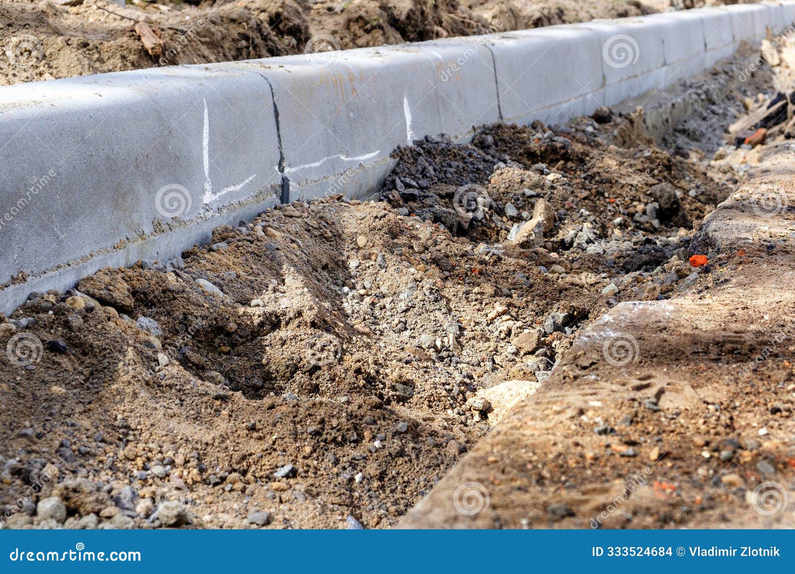 A Sidewalk is Under Construction, a Concrete Curb is Being Installed ...
