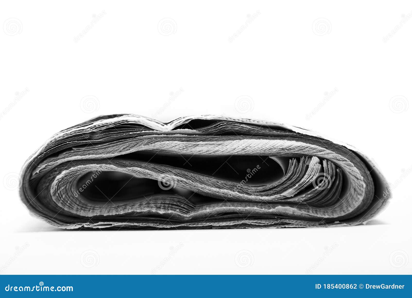 Sideways View of a Rolled Up Newspaper Stock Photo - Image of tabloid ...