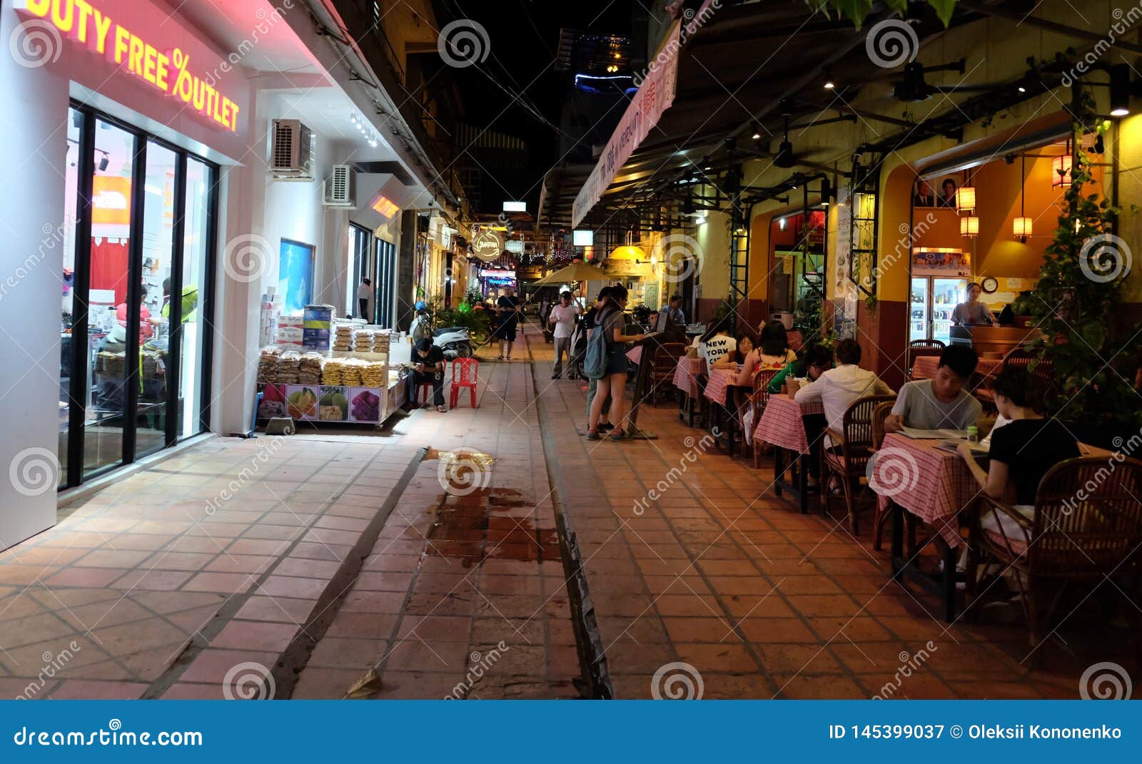 People Eat Dinner at a Cafe Outside, Night Time Editorial Photography ... People Eat Dinner at a Cafe Outside, Night Time Editorial Photography ...