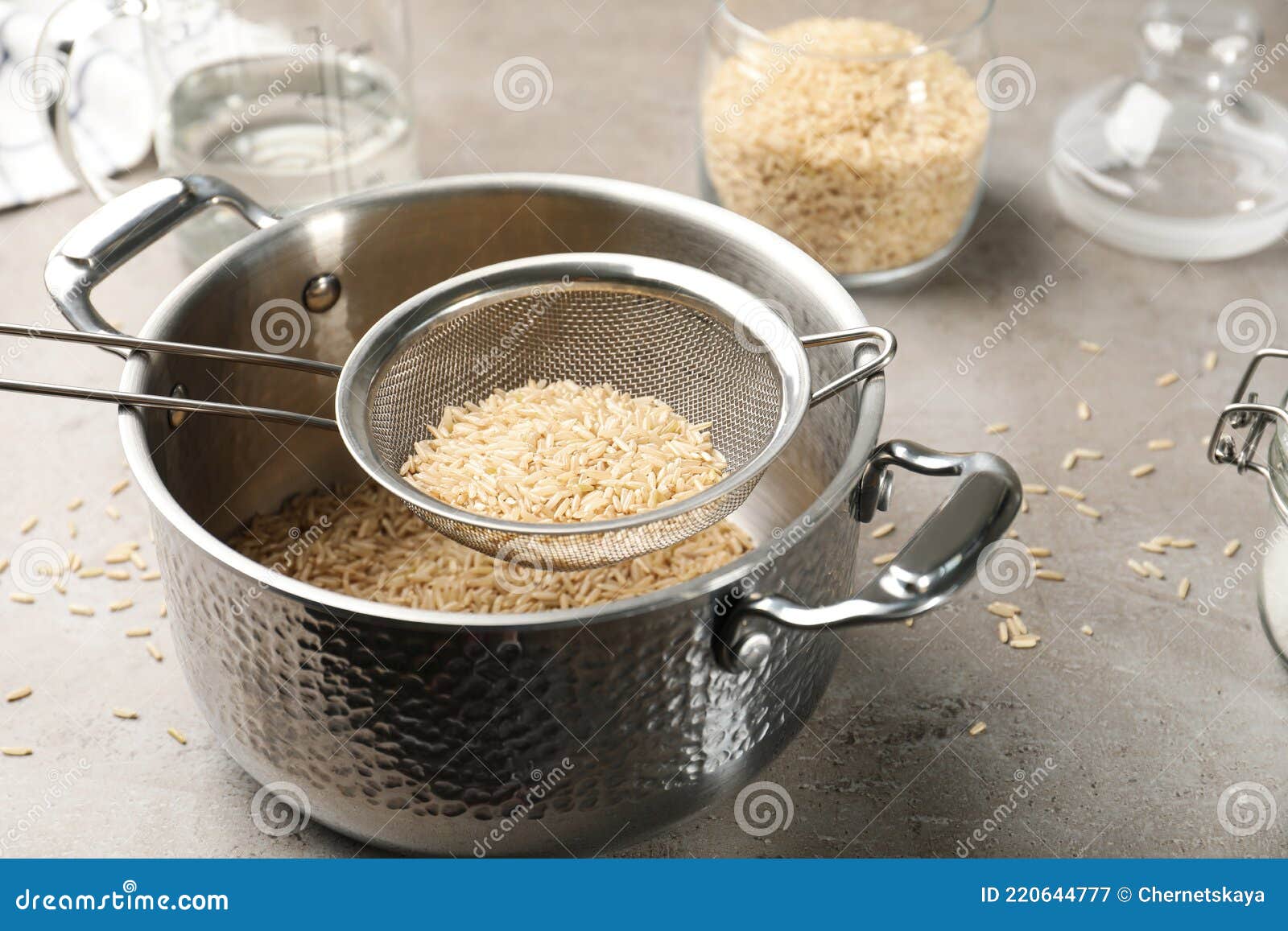 Sieve with Rice in Pot on Grey Table Stock Image - Image of kitchen ...