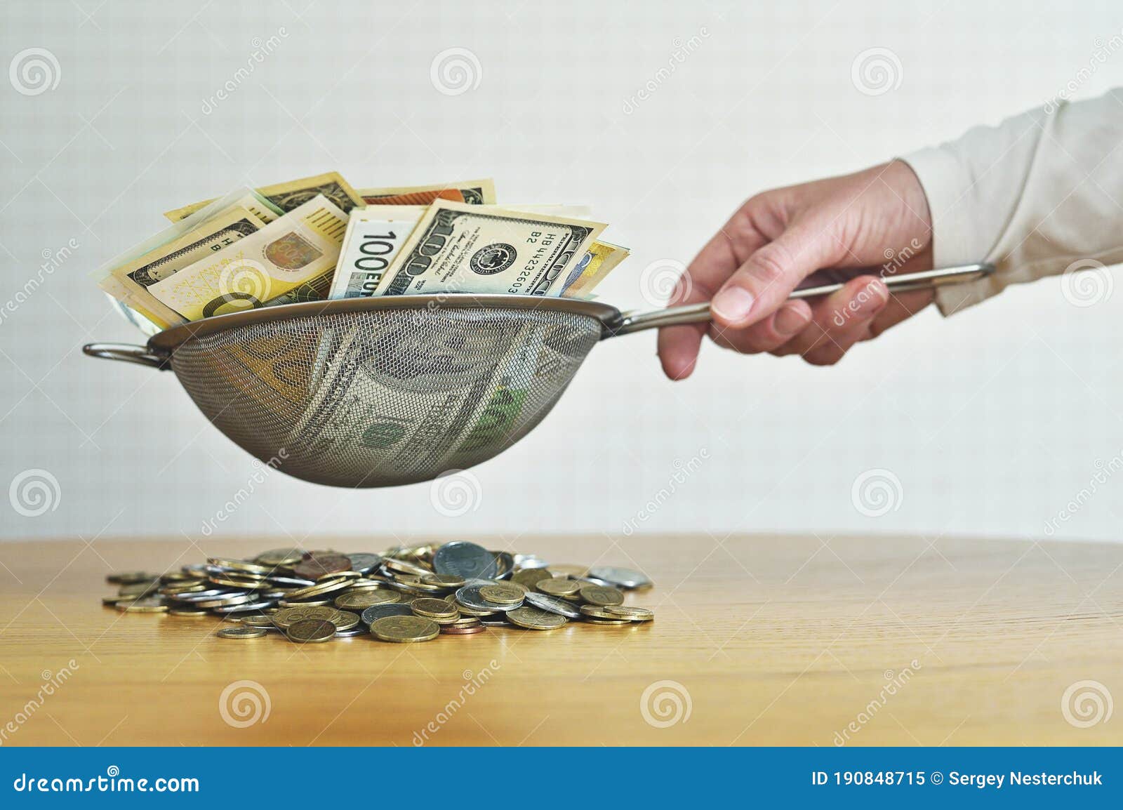 Sift Money through a Sieve. Coins Fall Out of the Sieve Stock Image ...