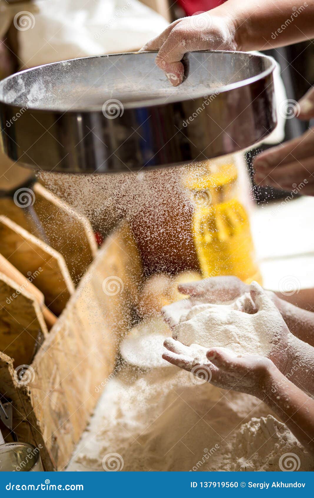Sifting flour using sieve stock photo. Image of table - 137919560