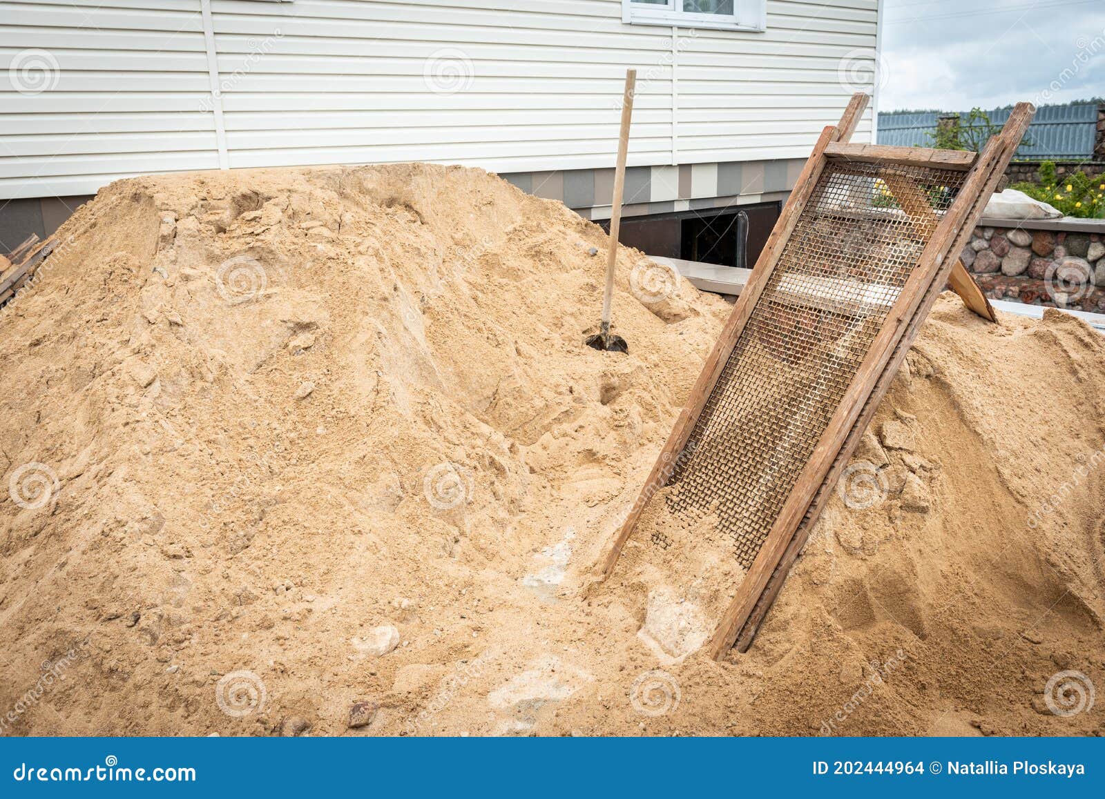 Sifting Sand through a Grid at a Construction Site Stock Photo - Image ...