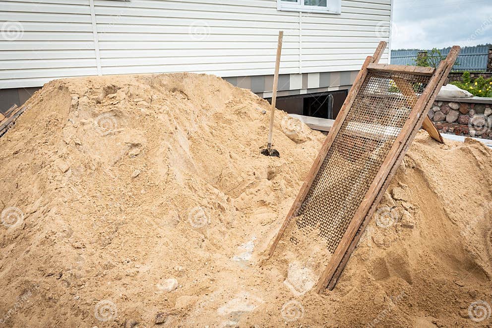 Sifting Sand through a Grid at a Construction Site Stock Photo - Image ...
