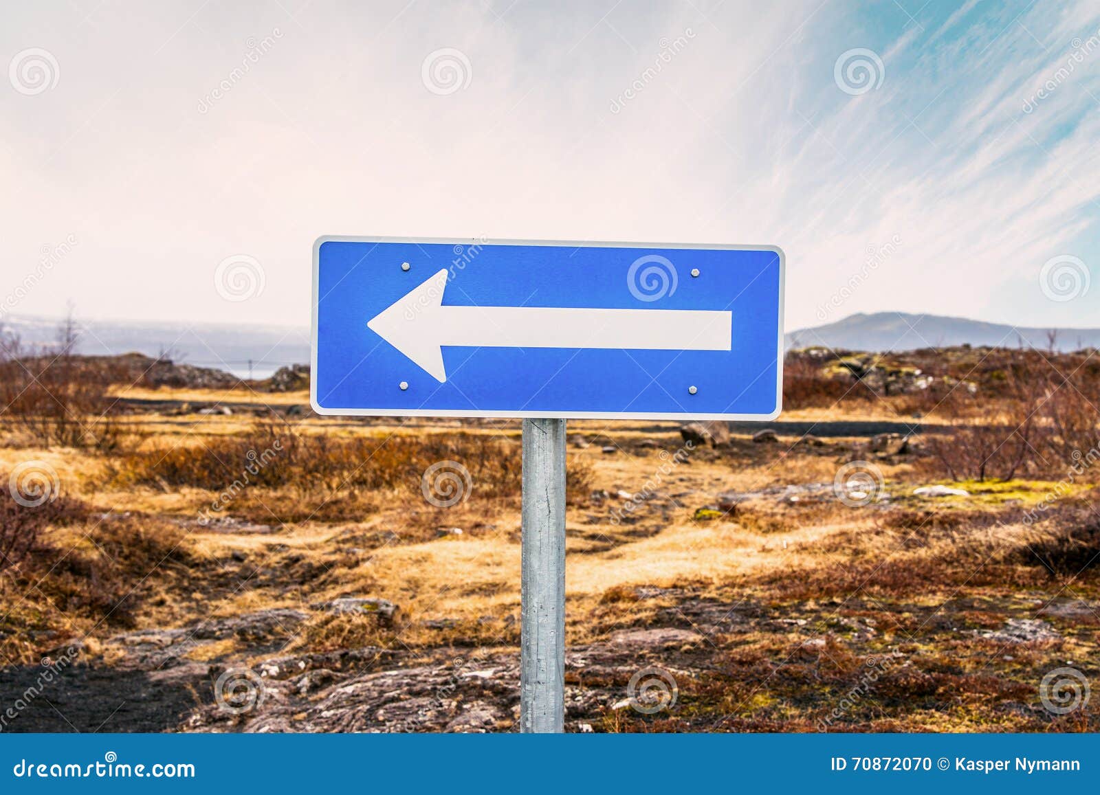 Sign with an Arrow Pointing Left Stock Photo - Image of mountains ...