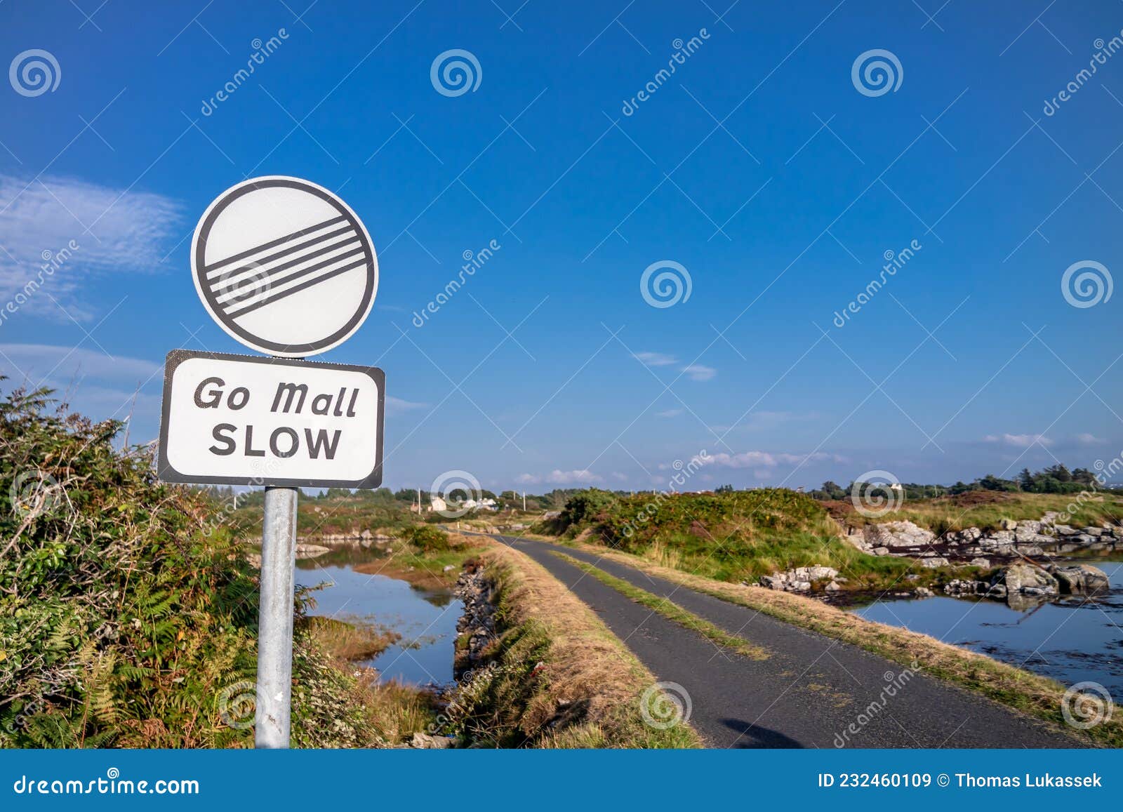Sign Asking for Driving Slow in Irish : Go Mall Stock Image - Image of ...