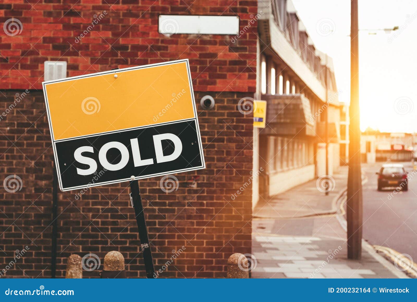 Sign on a Brick Wall with Sold Written on it Stock Photo - Image of ...