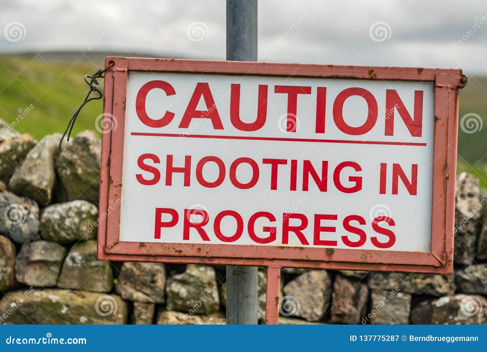 Sign: Caution - Shooting in Progress Stock Image - Image of highland ...