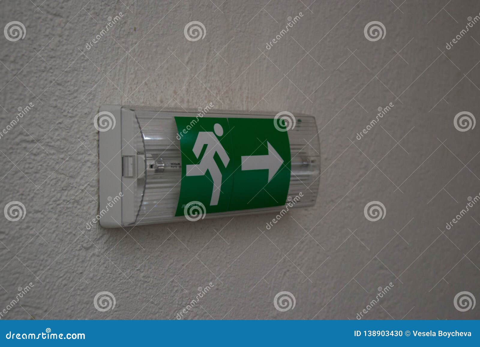 Exit Sign on a White Wall in a Building Stock Photo - Image of ...