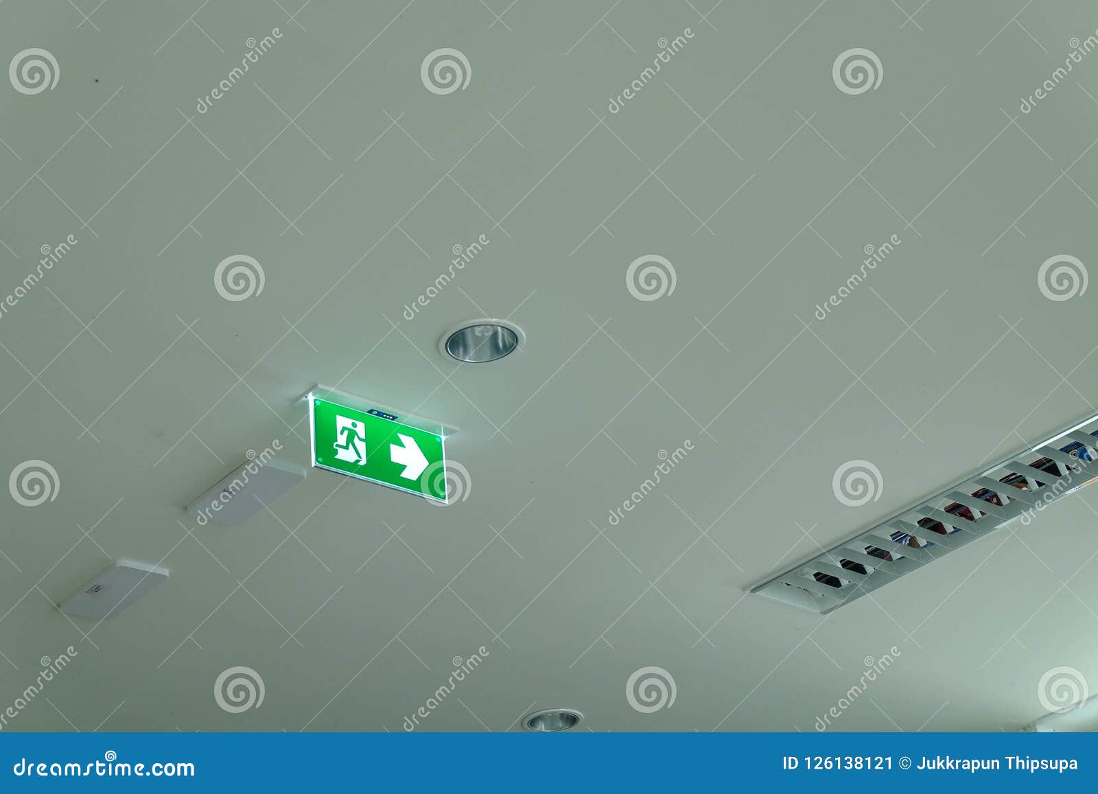 The Sign of Fire Exit at the Corridor in Building Stock Image - Image ...
