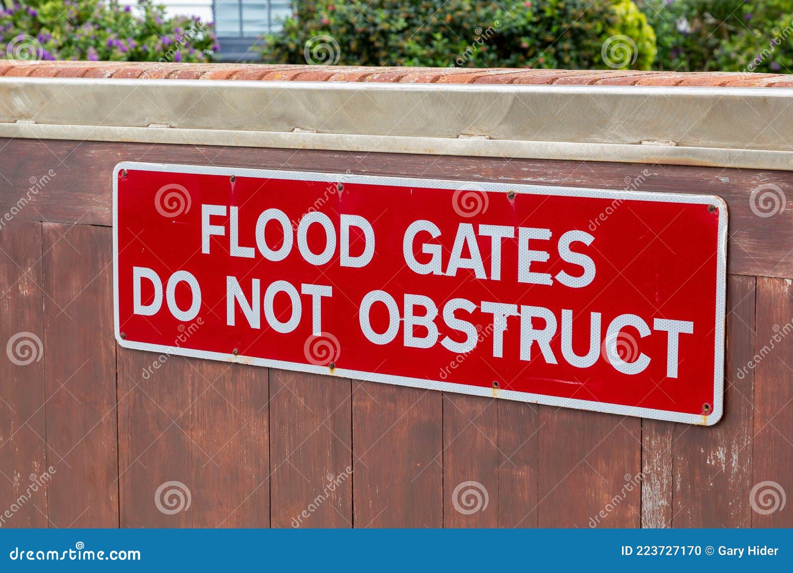 A Sign on a Flood Gate that Reads Flood Gates Do Not Obstruct Stock ...