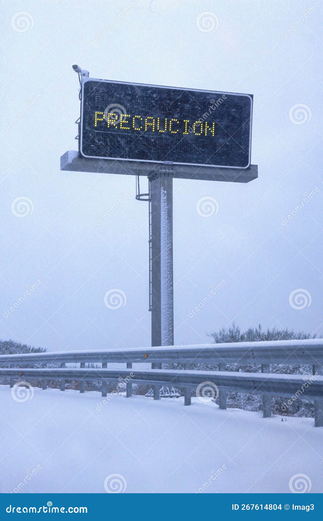 Sign on a Highway Under a Heavy Snowfall Showing the Legend Caution ...