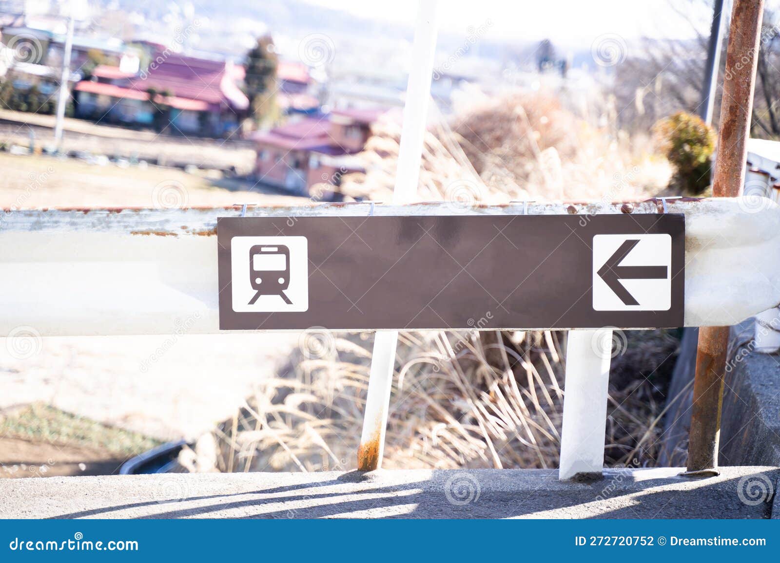 The Sign Indicating the Way To the Train on the Railing on the Side of ...