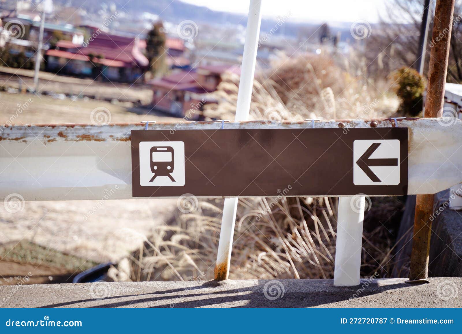 The Sign Indicating the Way To the Train on the Railing on the Side of ...