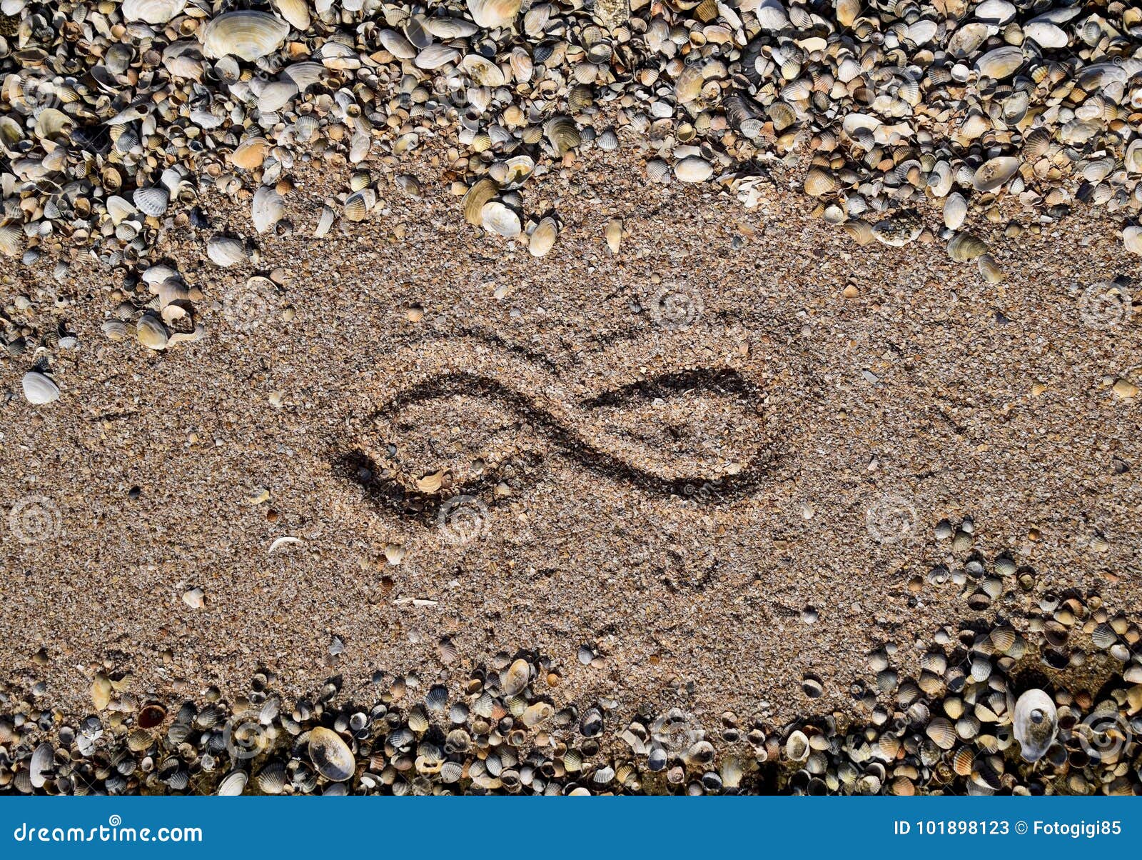 The Sign of Infinity on the Sea. Coastal Sand on the Beach Stock Image ...