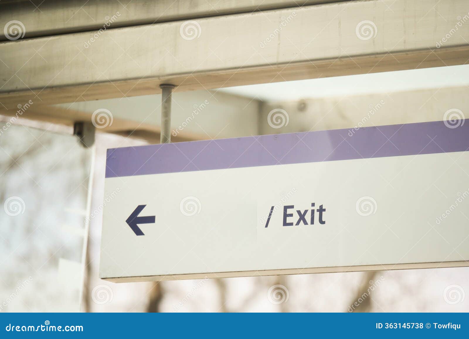 Sign Pointing Left Toward Exit in a Public Space Stock Photo - Image of ...