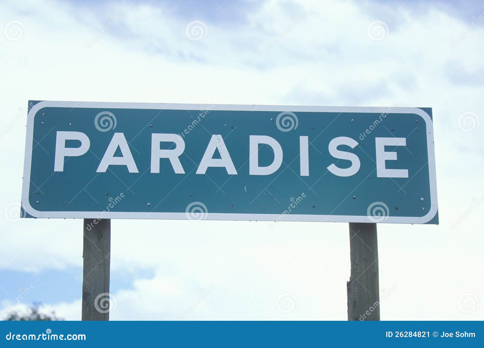 A sign that reads Paradise stock image. Image of road - 26284821