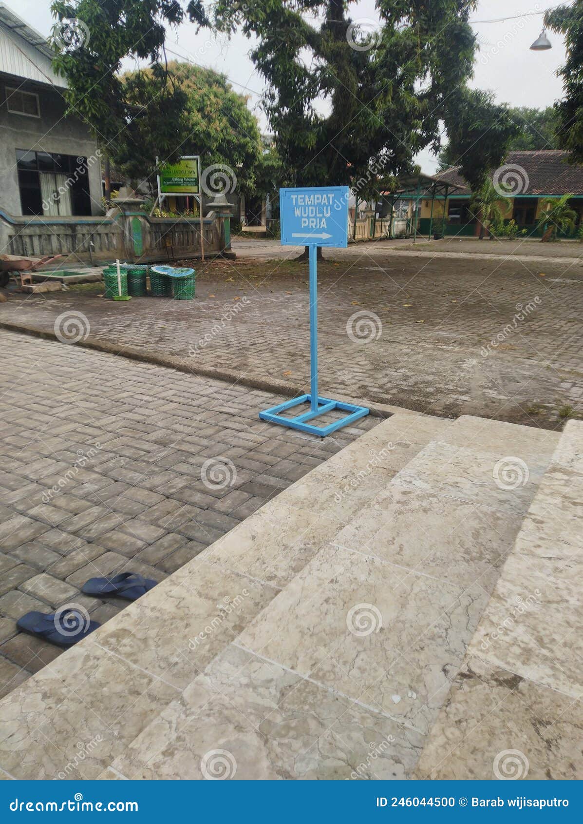 A Sign that Says Directions To the Ablution Place in Front of the ...