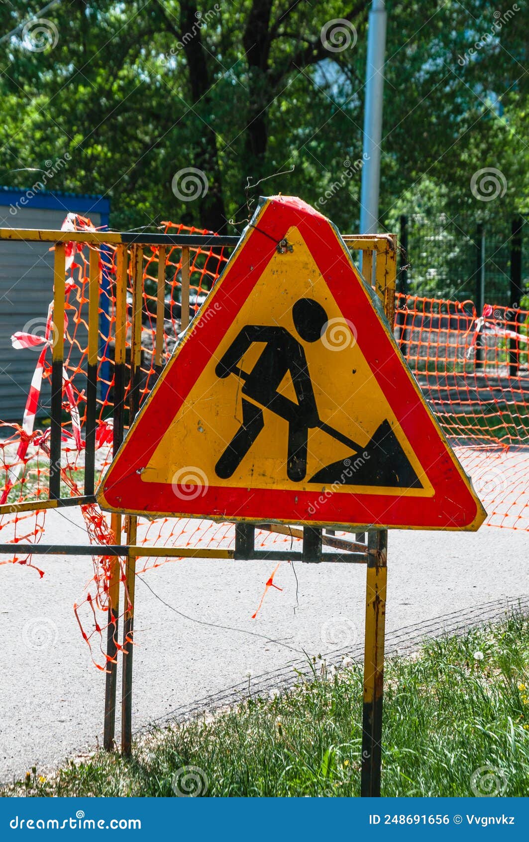 A Sign Under Construction on a Closed Road. a Warning Sign Under ...