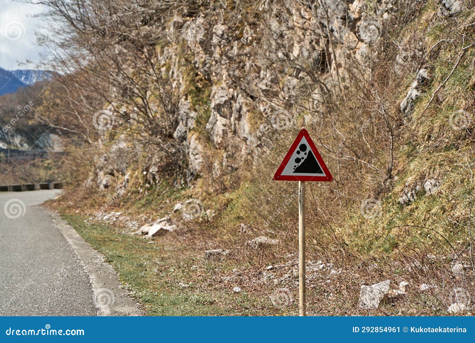 A Sign Warning of Rock Falls Along a Highway in the Mountains Stock ...