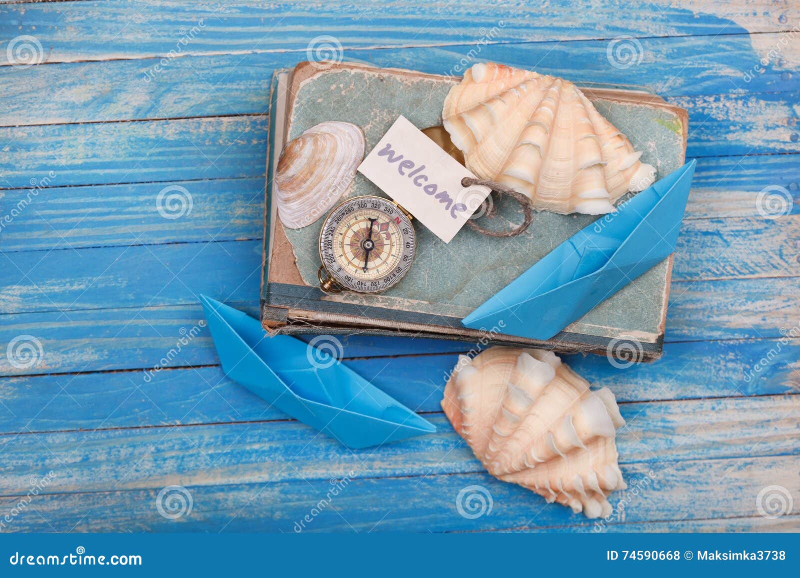Sign Welcome and Compass on Old Book - Vintage Style Stock Photo ...