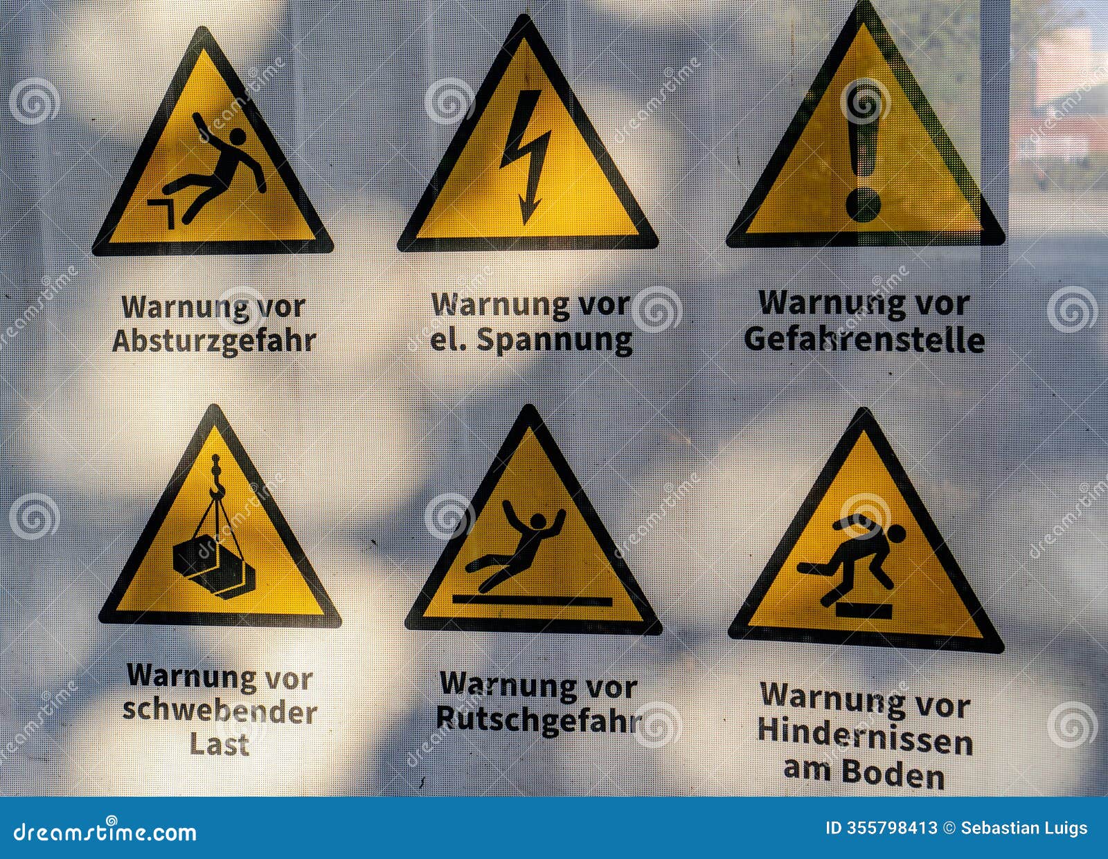 A Sign with a Yellow Triangle and a Black Border with the Word Warning ...