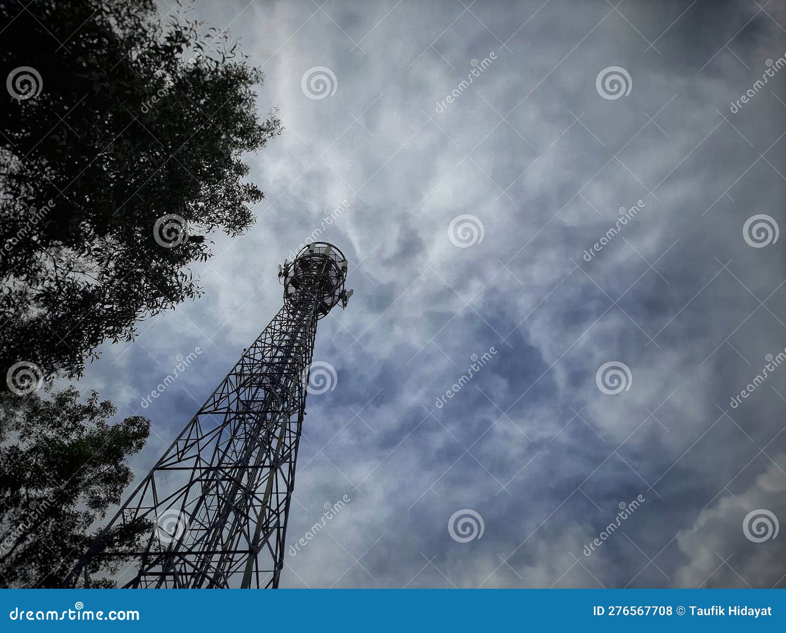 The Signal Tower Stands Tall among the Overcast Clouds Stock Photo ...