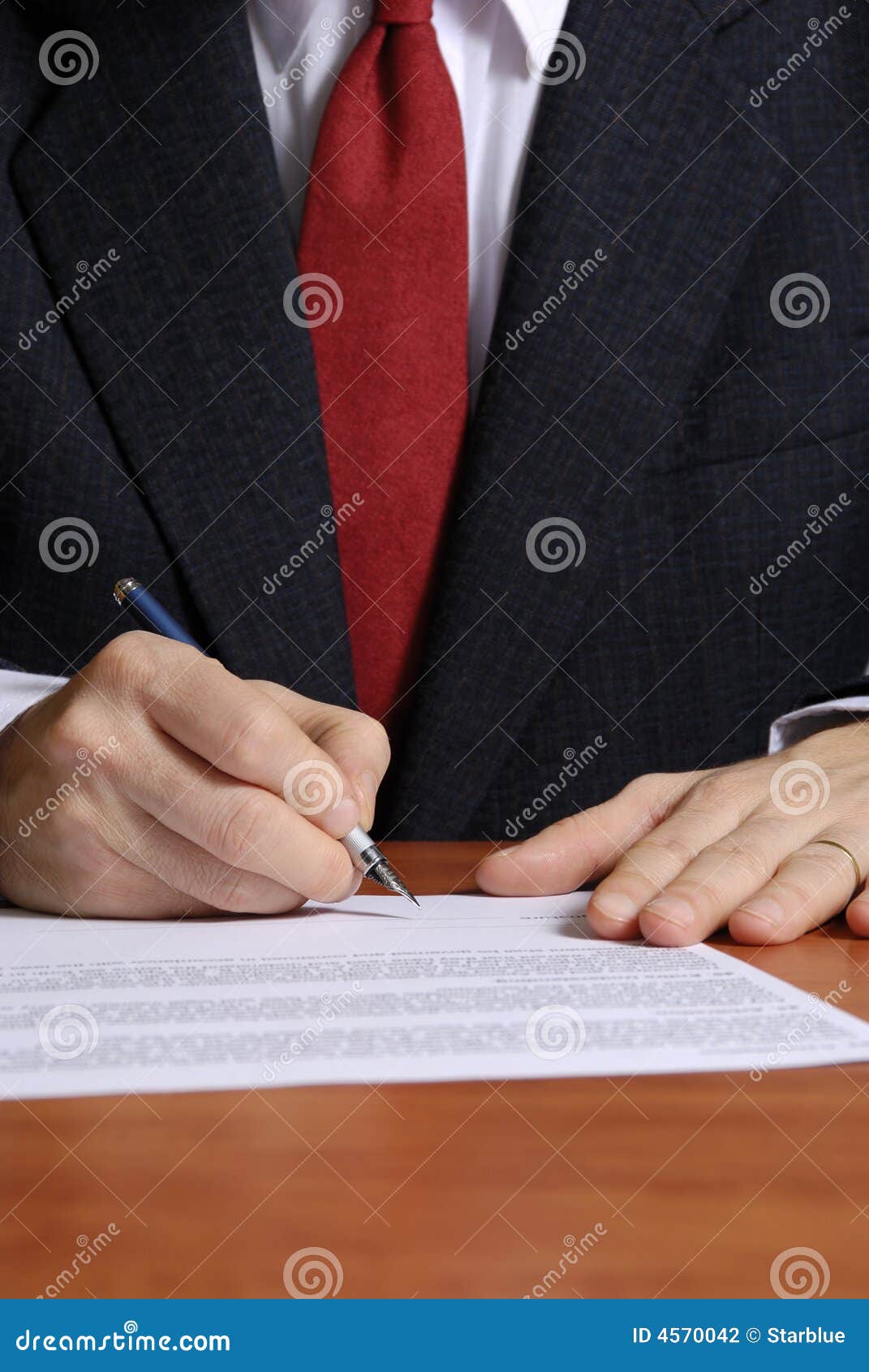 Signing a contract stock photo. Image of signature, contract - 4570042