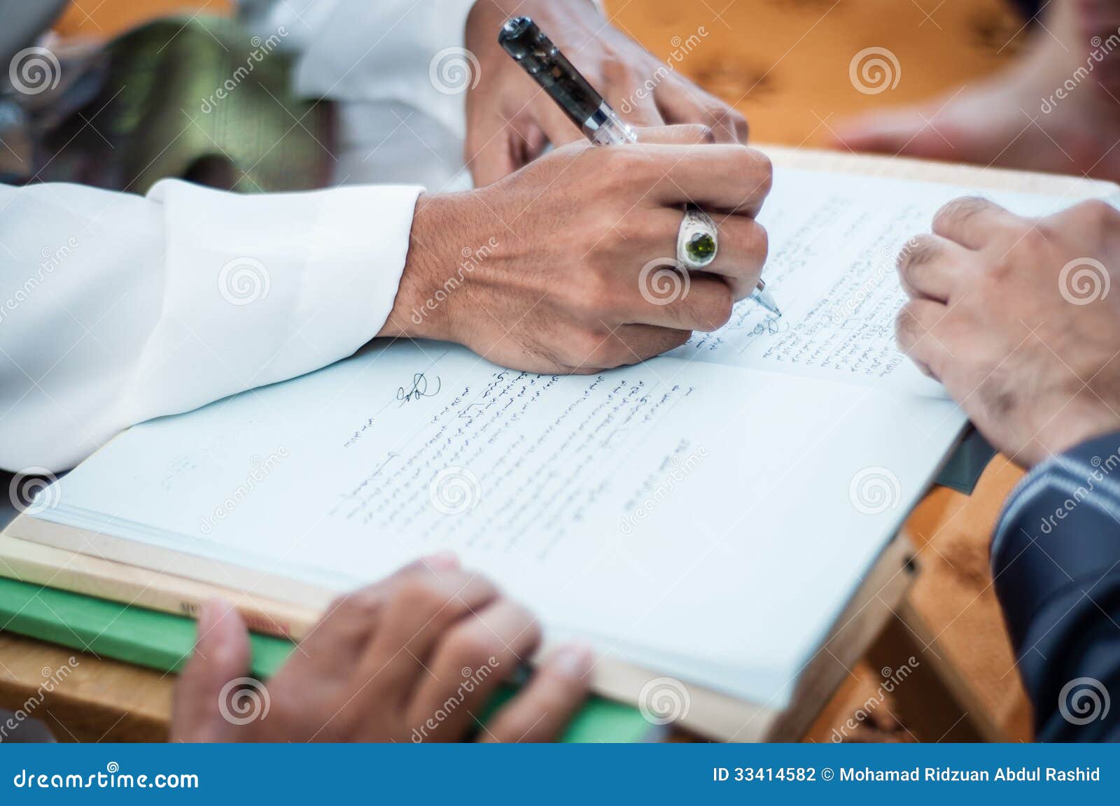 Signing Oath in Arabic Writings Stock Photo - Image of hands, ceremony ...