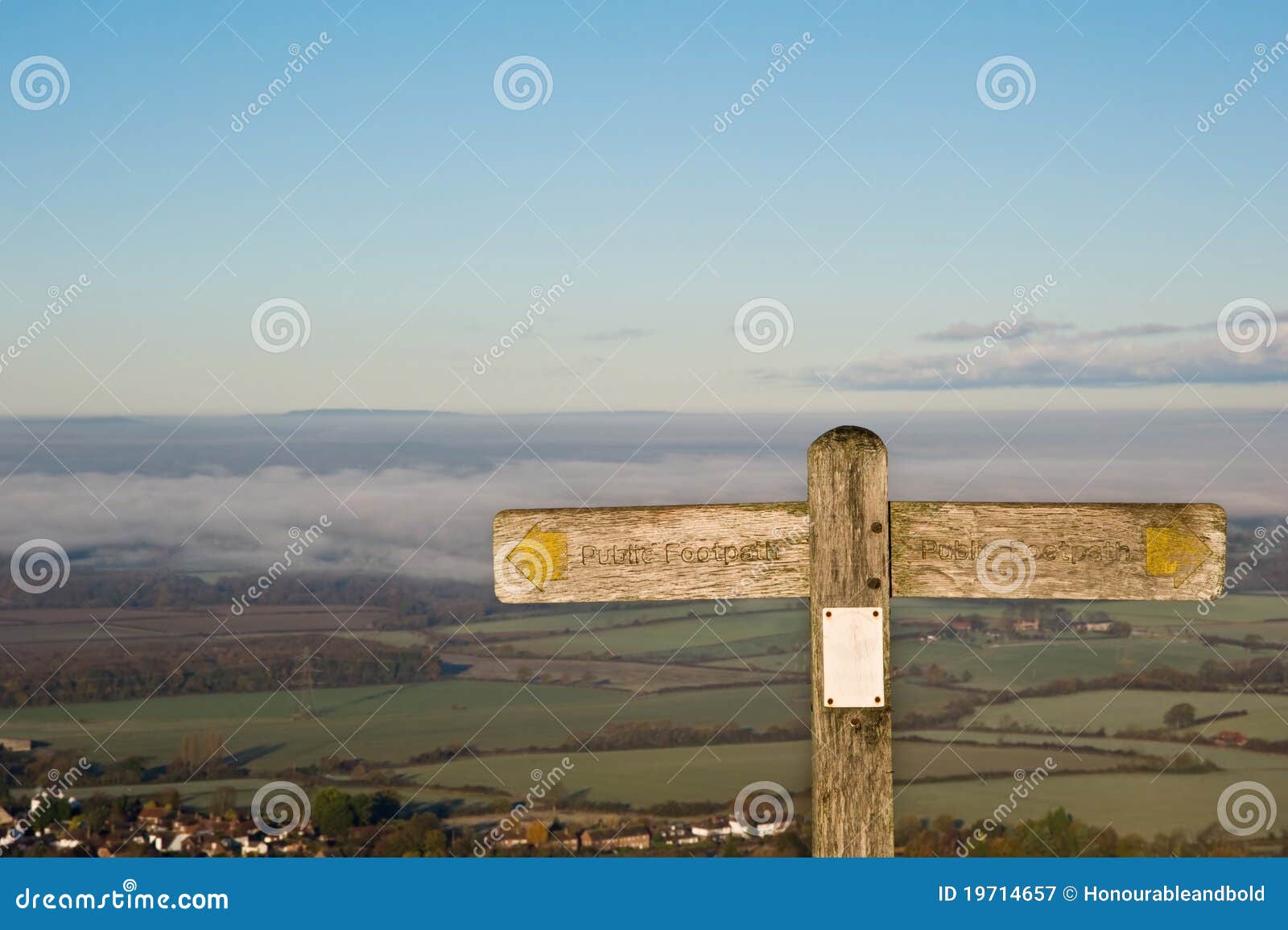 Signpost in Front of Countryside Landscape Stock Image - Image of ...