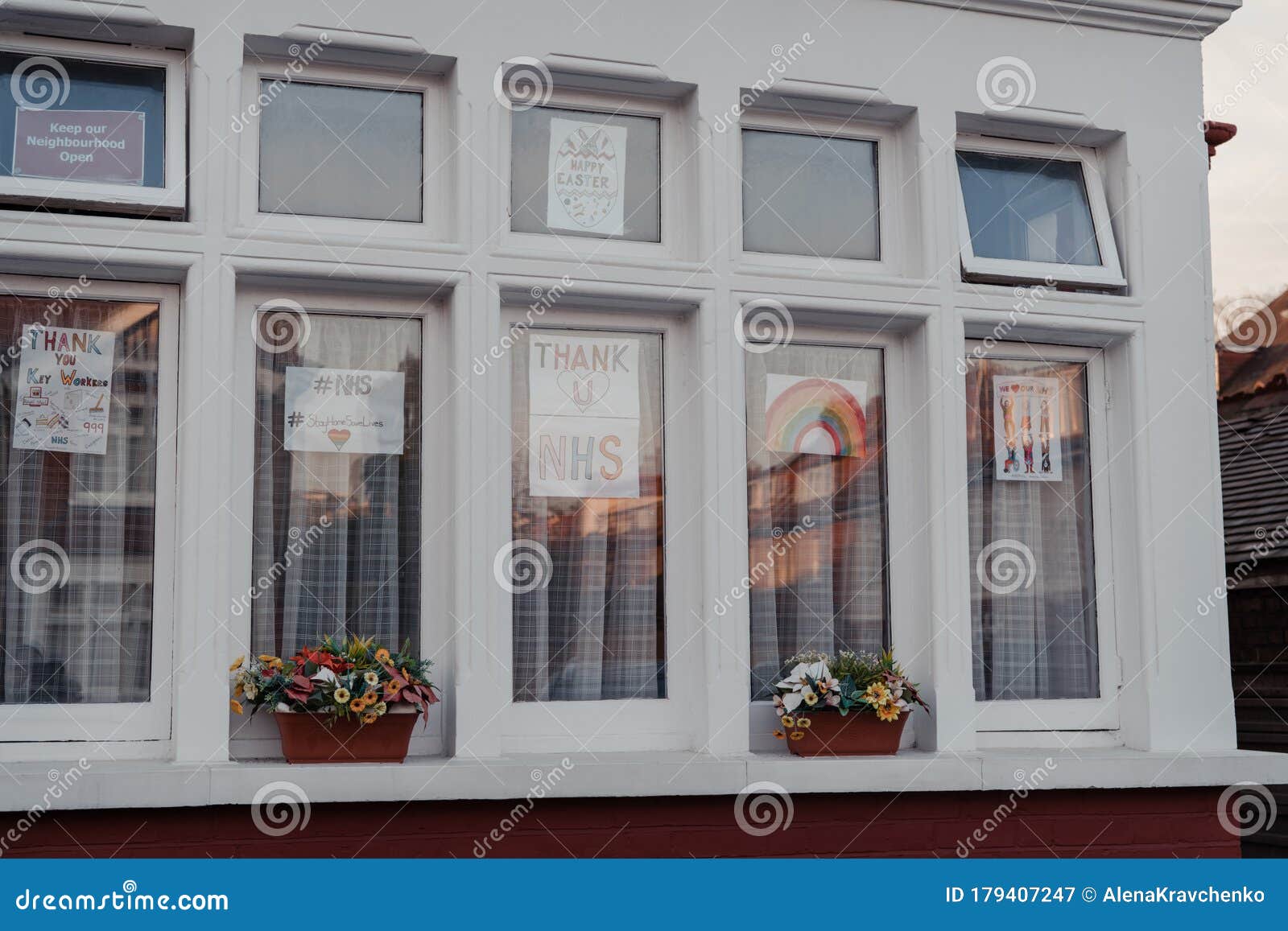 Signs with Rainbow, Stay Safe and Thank You NHS Messages in a Window of ... Signs with Rainbow, Stay Safe and Thank You NHS Messages in a Window of ...