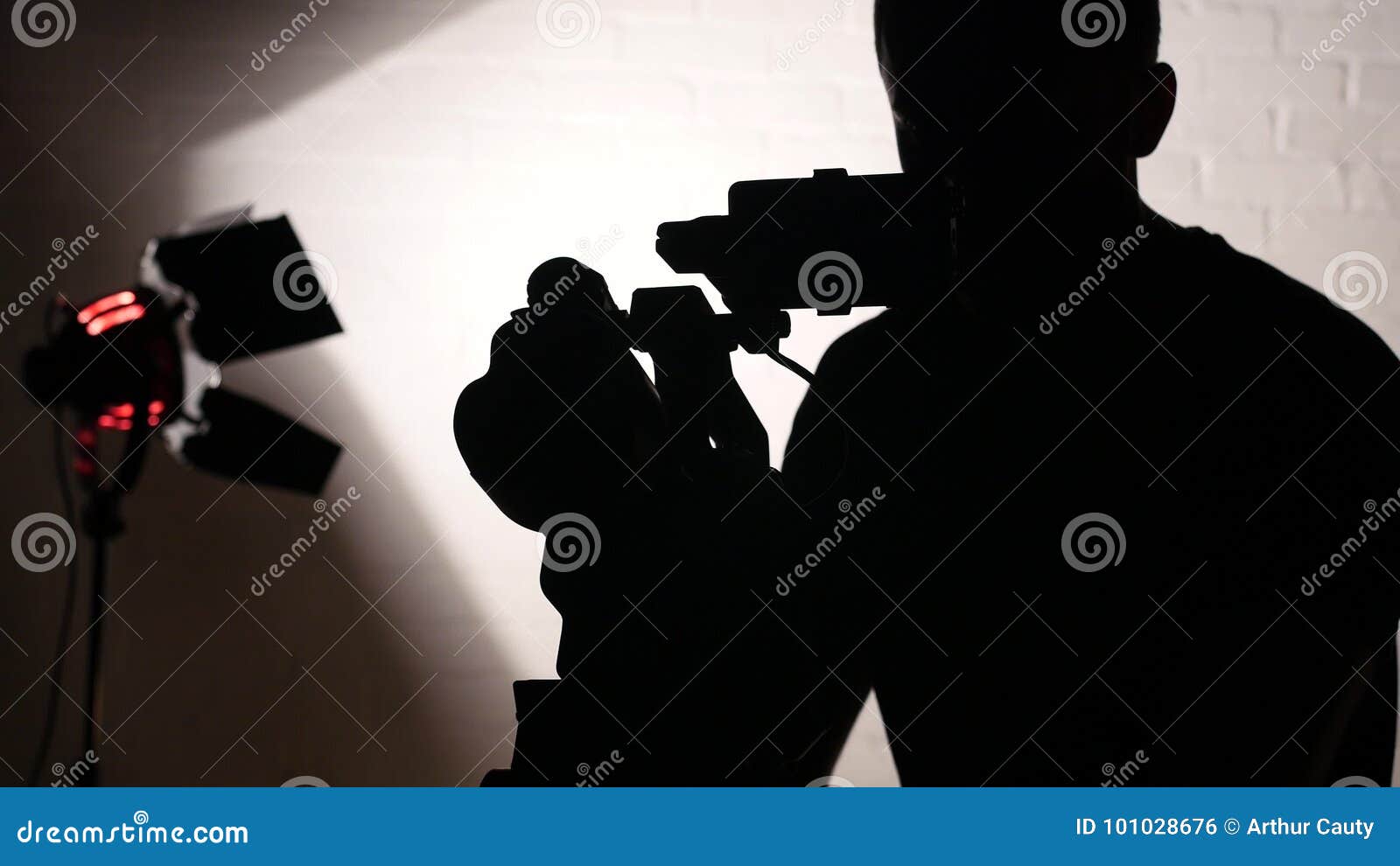 Silhouette of Cameraman Working Behind the Scenes in Film Studio Stock ...