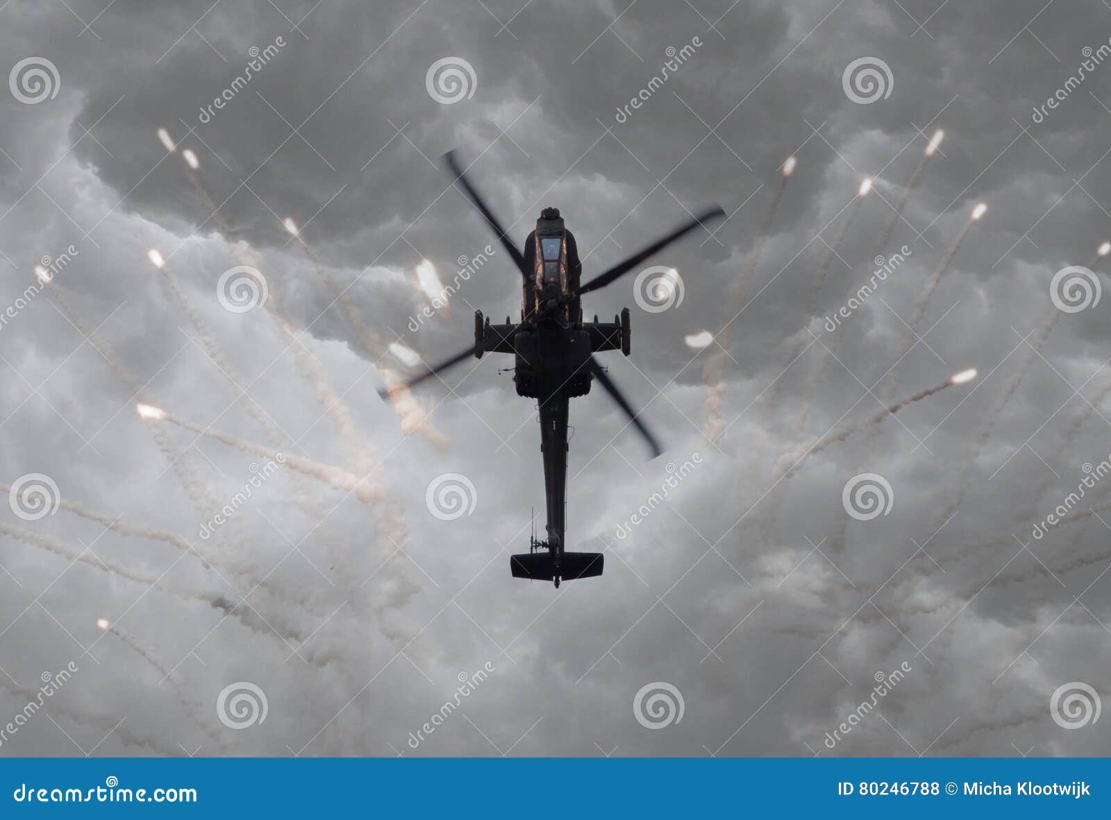 Silhouette of an Attack Helicopter Firing Flares Stock Photo - Image of ...