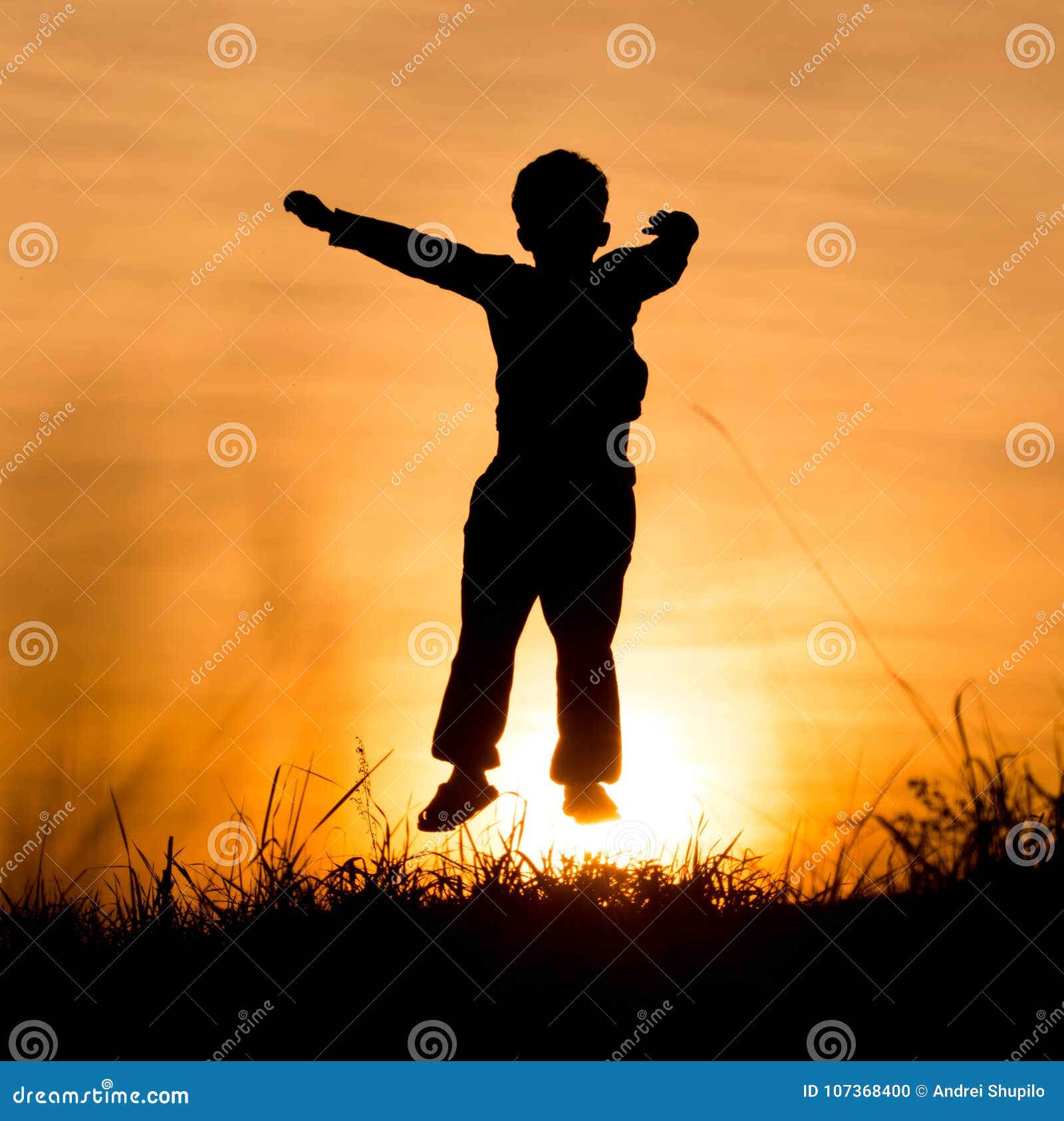 Silhouette of a Boy Jumping at Sunset Stock Photo - Image of happy ...