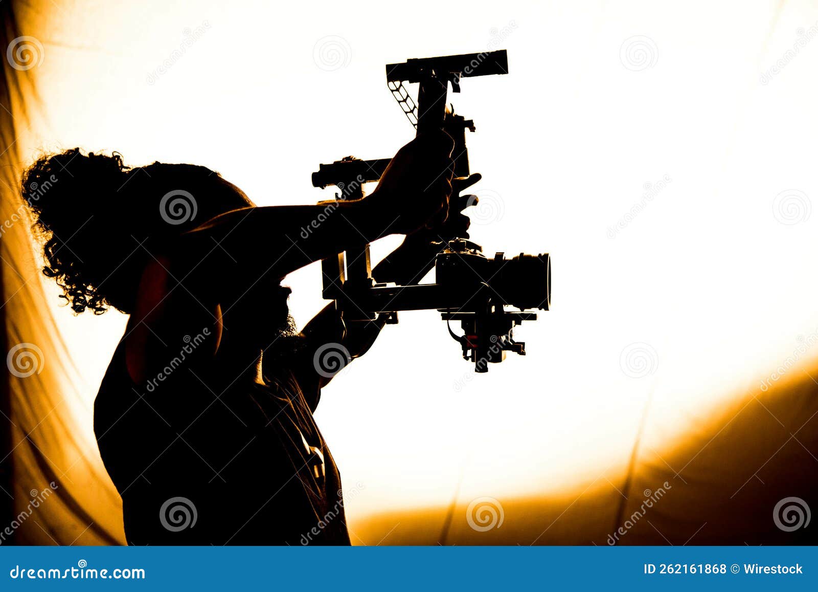 Silhouette of a Cameraman Shooting a Video Stock Photo - Image of ...