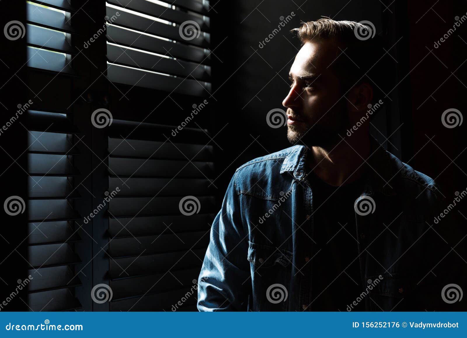 Silhouette of Caucasian Thoughtful Man Standing in Dark Room at Shadow ... Silhouette of Caucasian Thoughtful Man Standing in Dark Room at Shadow ...