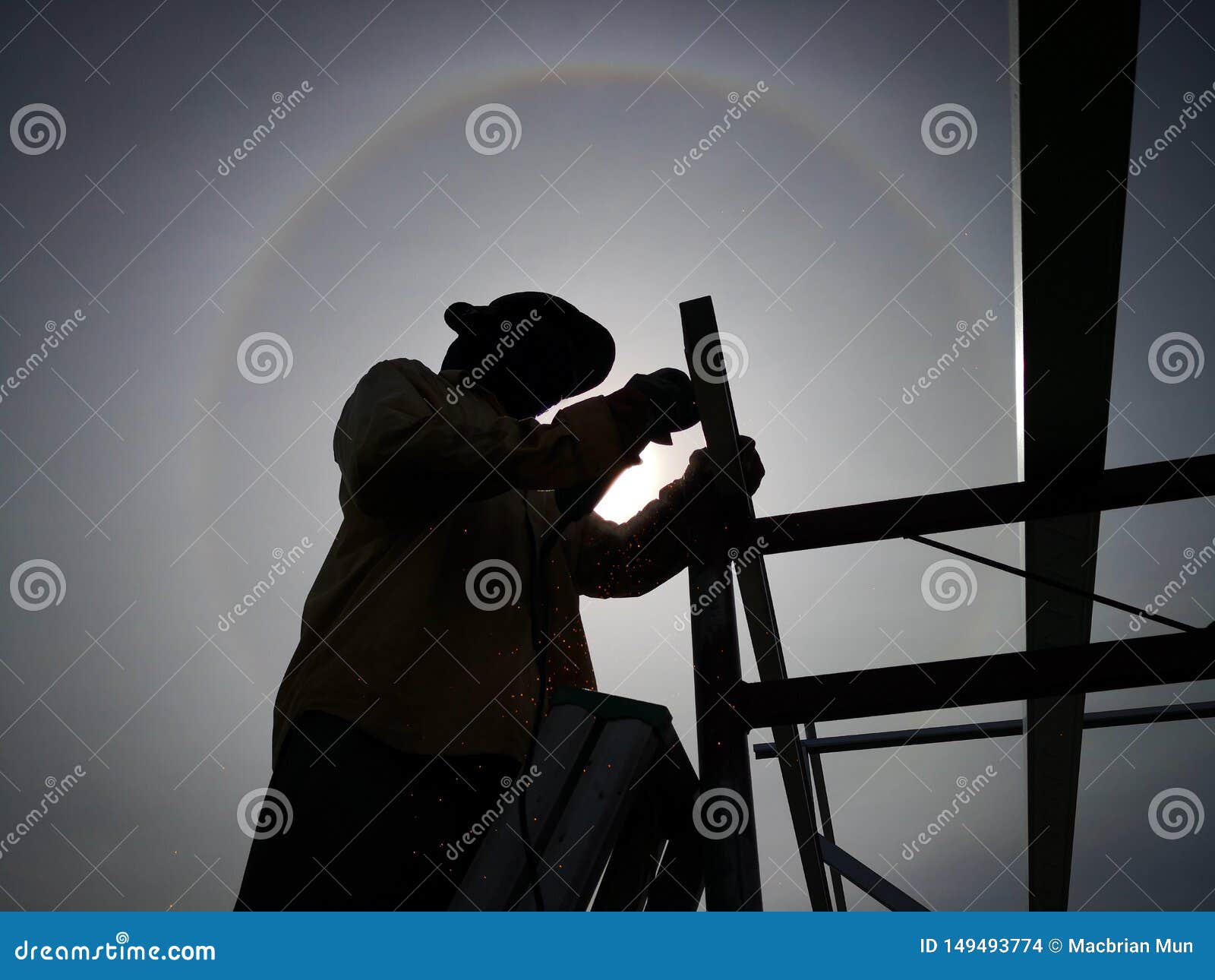 Silhouette of a Construction Worker Working Under Hot Sun Stock Photo ...