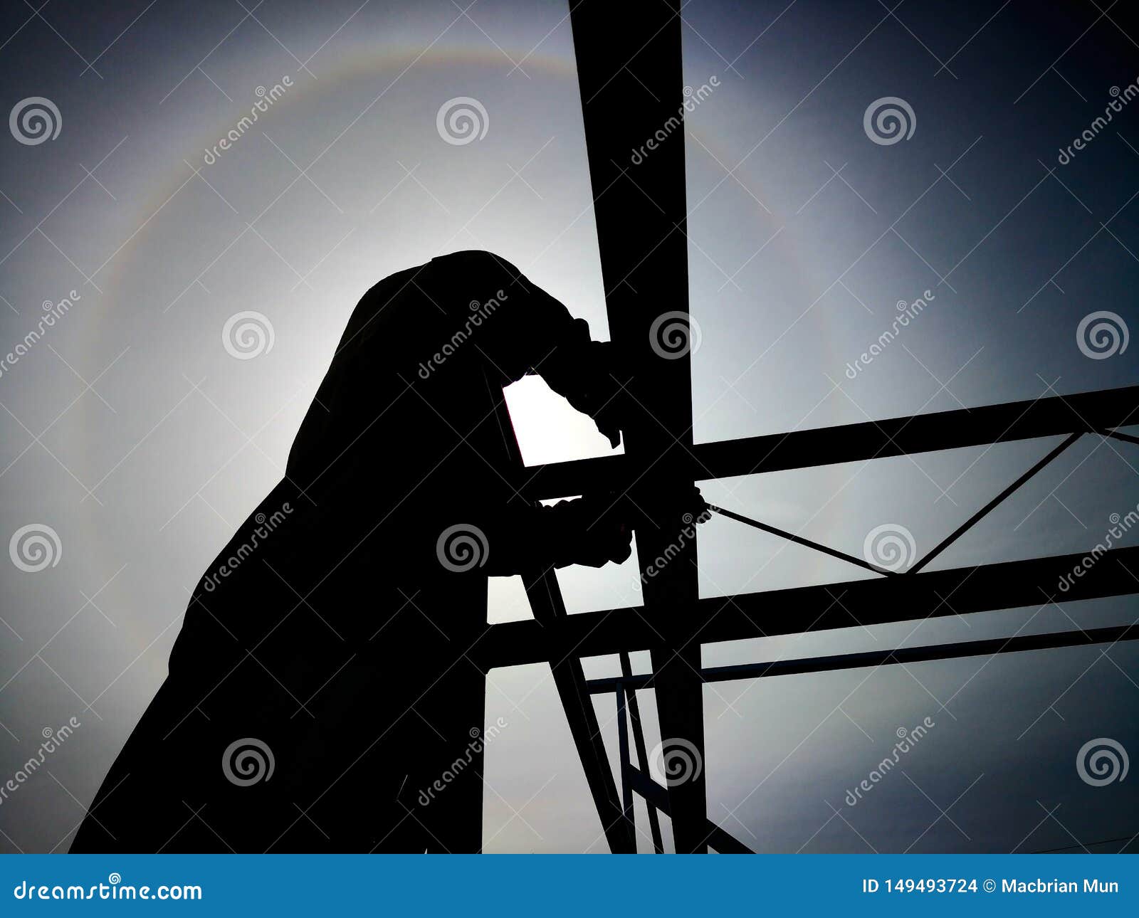 Silhouette of a Construction Worker Working Under Hot Sun Stock Photo ...