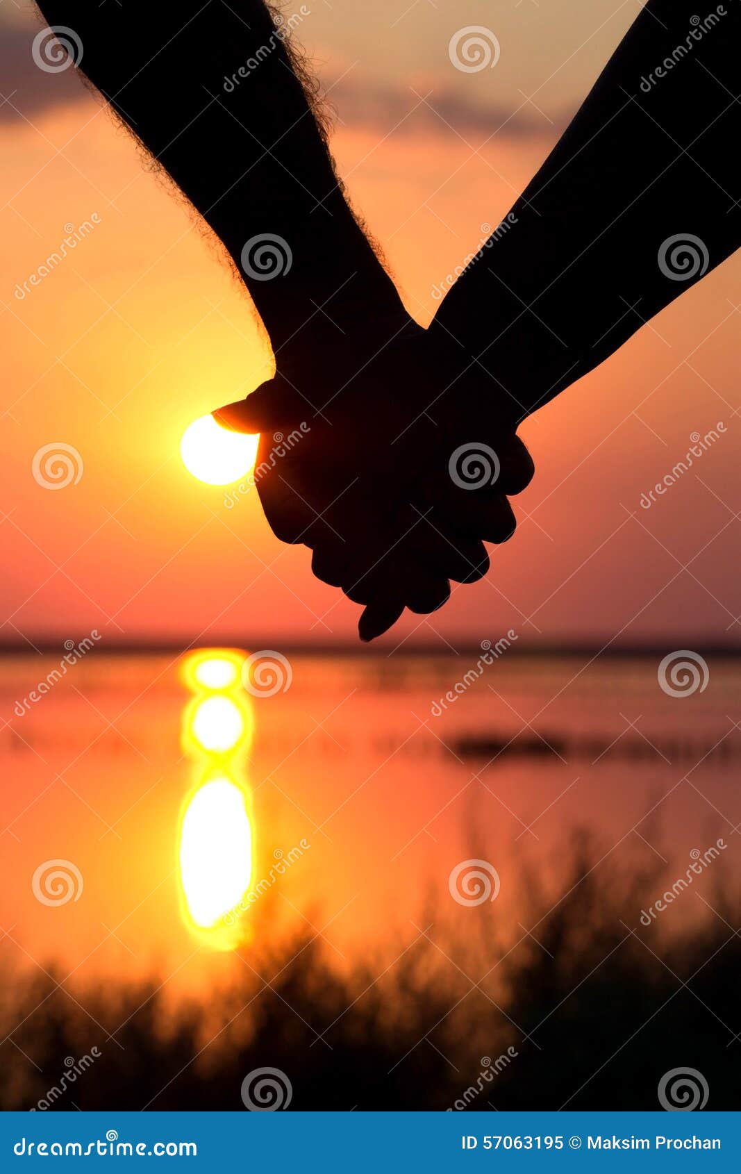 Couple Holding Hands Sunset