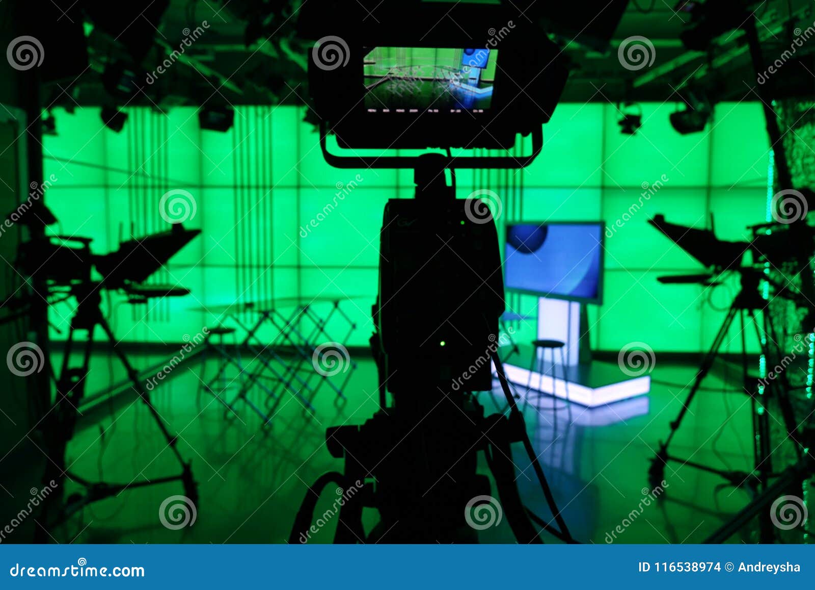 Silhouette of a Digital Video Camera in Front of a Green Screen. Stock ...
