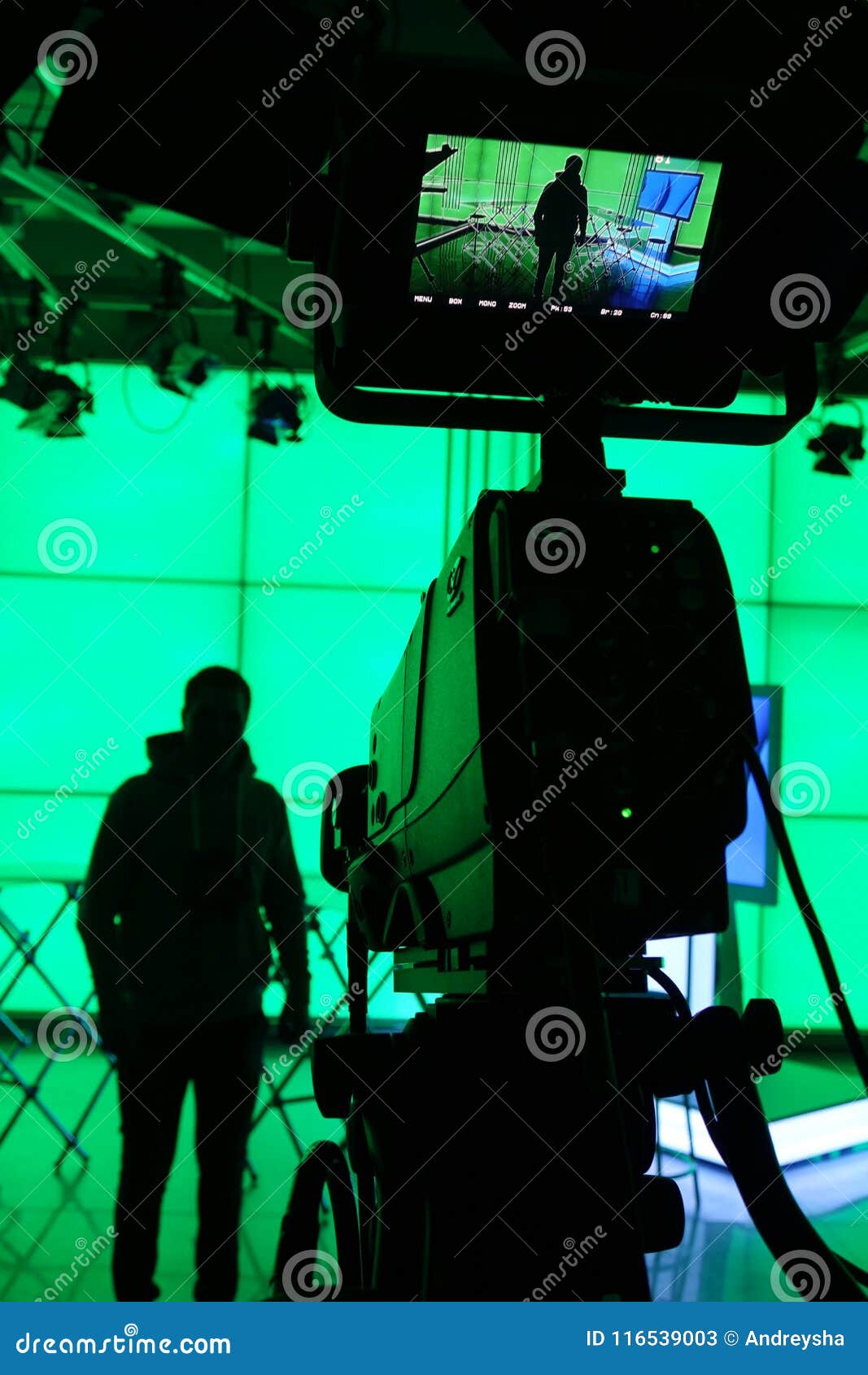 Silhouette of a Digital Video Camera in Front of a Green Screen. Stock ...