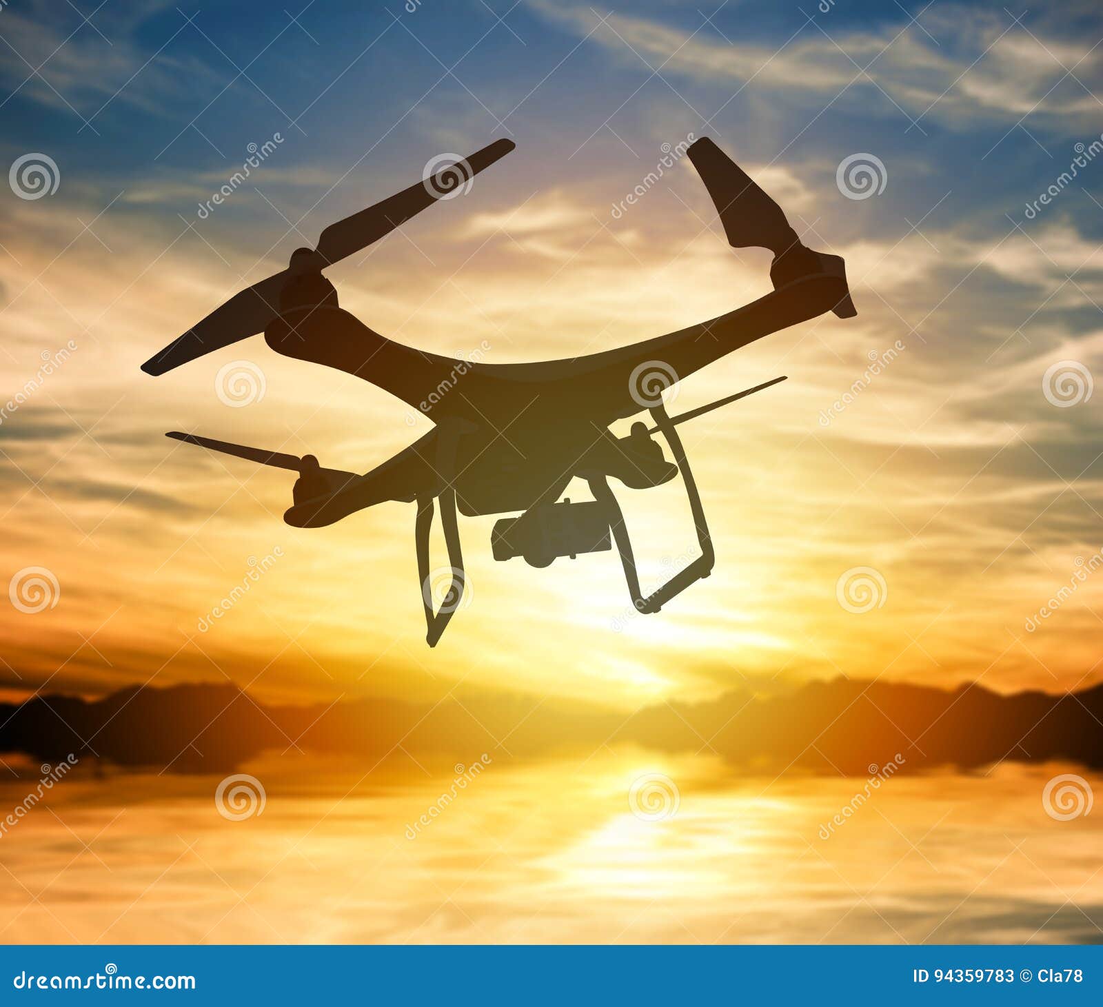 Silhouette of a Drone with Digital Camera Flying in a Sunset Sky Stock ...