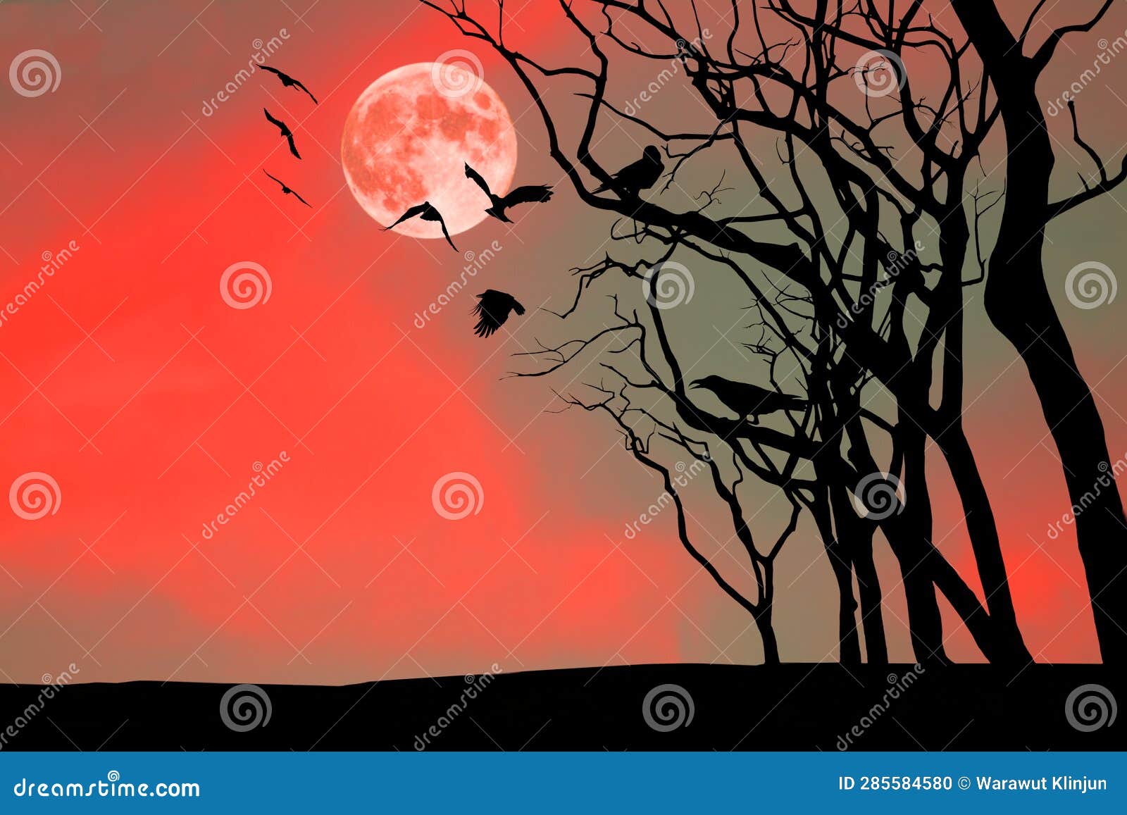 Silhouette of a Dry Tree with a Flock of Crows Flying in a Red Full ...