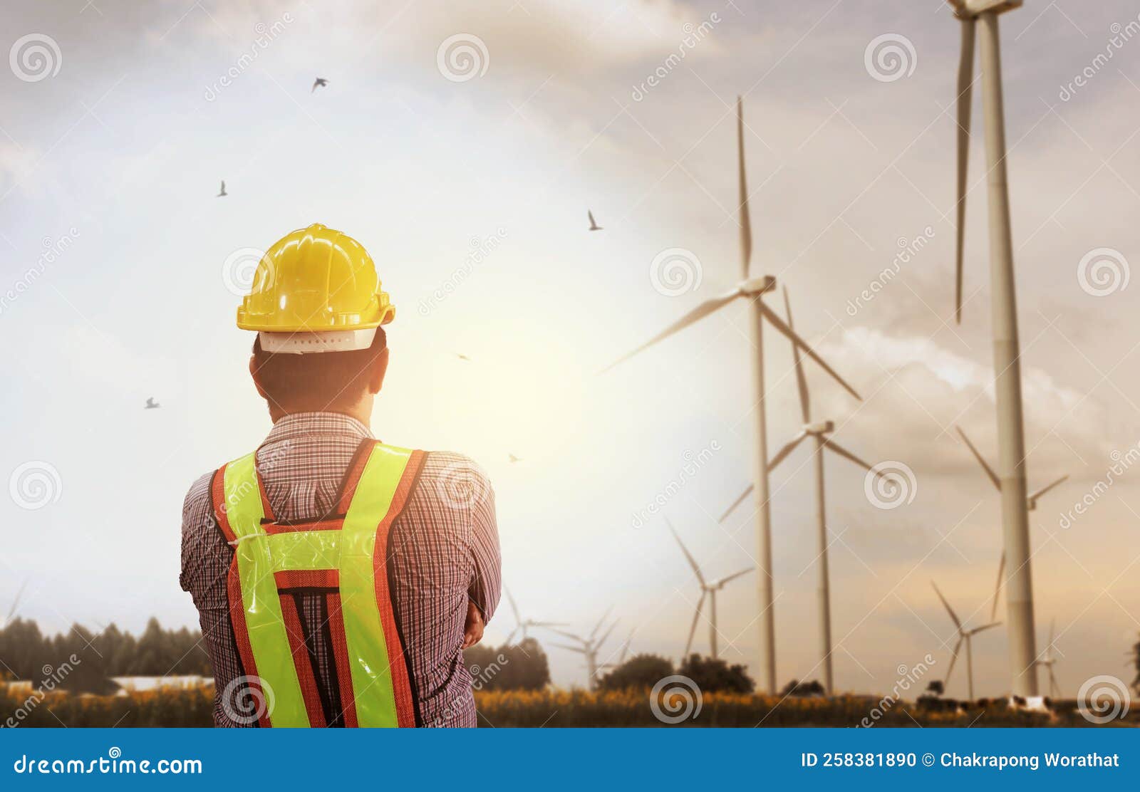 Silhouette of Engineers Checking Project at Wind Turbine Site on Sunset ...