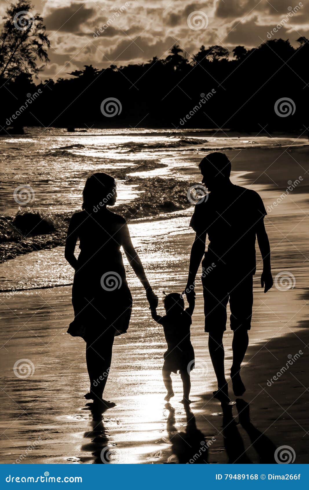 Silhouette of Family on the Beach at Sunset Stock Photo - Image of ...