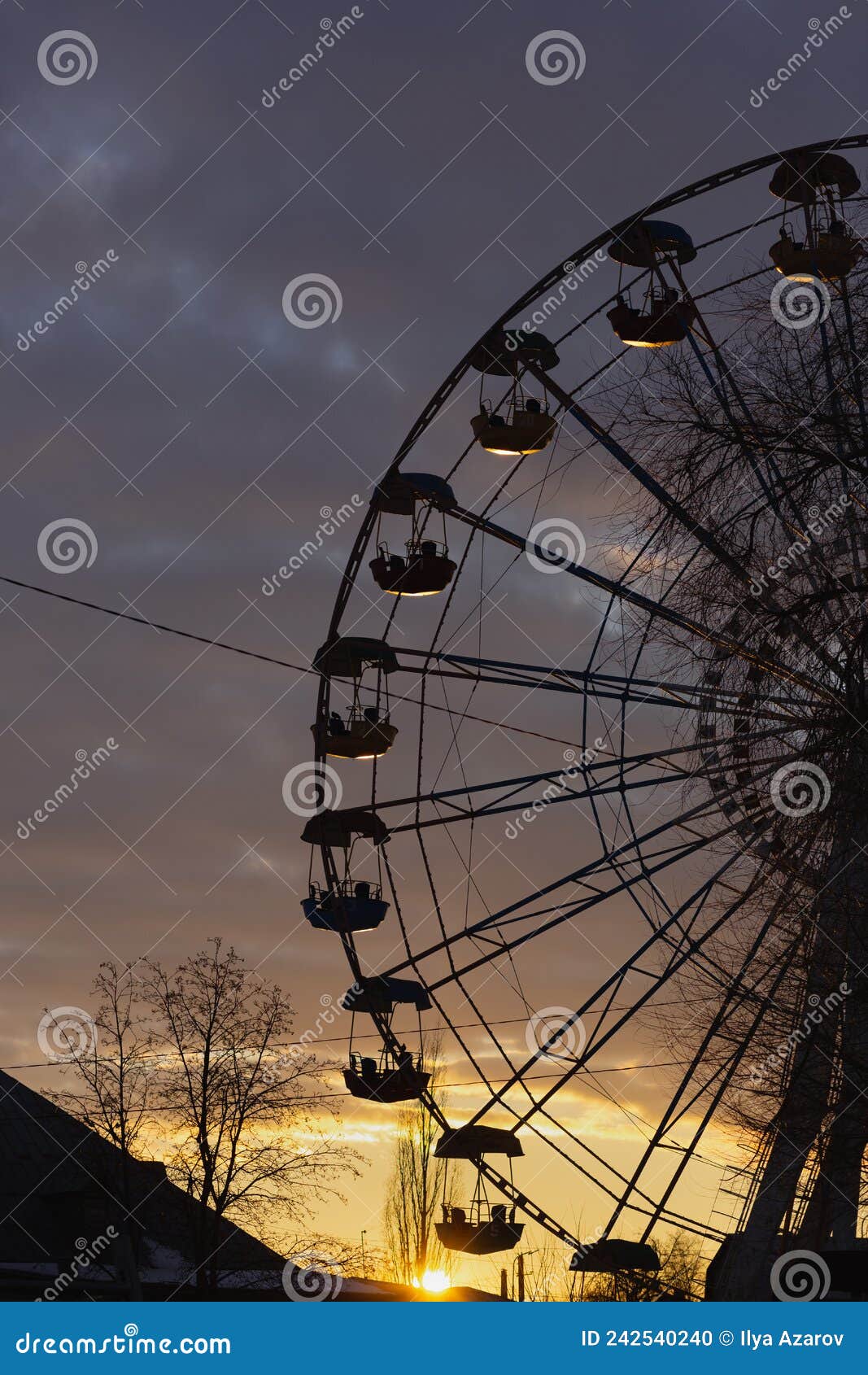 A Silhouette of a Ferring Wheel. Cubs Lit from the Bottom from the ...