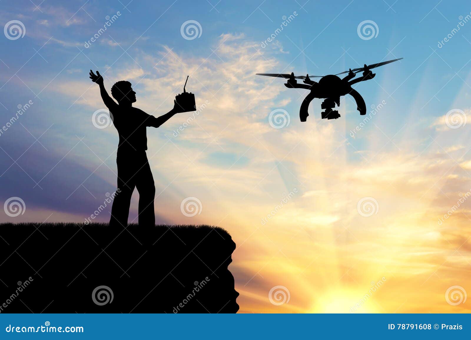 Silhouette of a Flying Drone, and a Man with a Remote Control on the ...